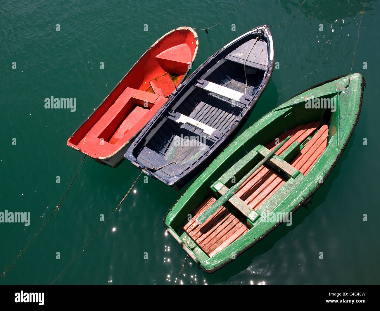 Horizontal portrait of three fishing boats in the port Stock Photo - Alamy