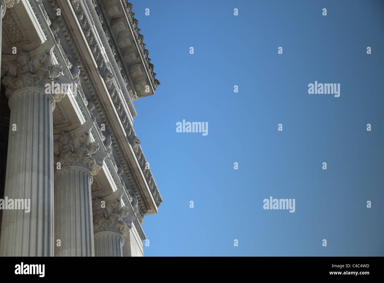 Roman Ionic Columns under a blue sky Stock Photo - Alamy