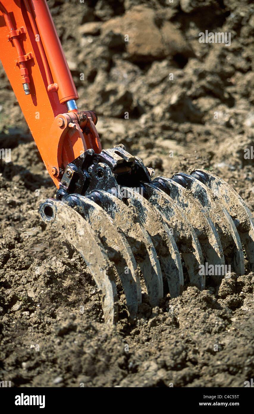 Detail of shaker bucket on hydraulic arm Stock Photo - Alamy