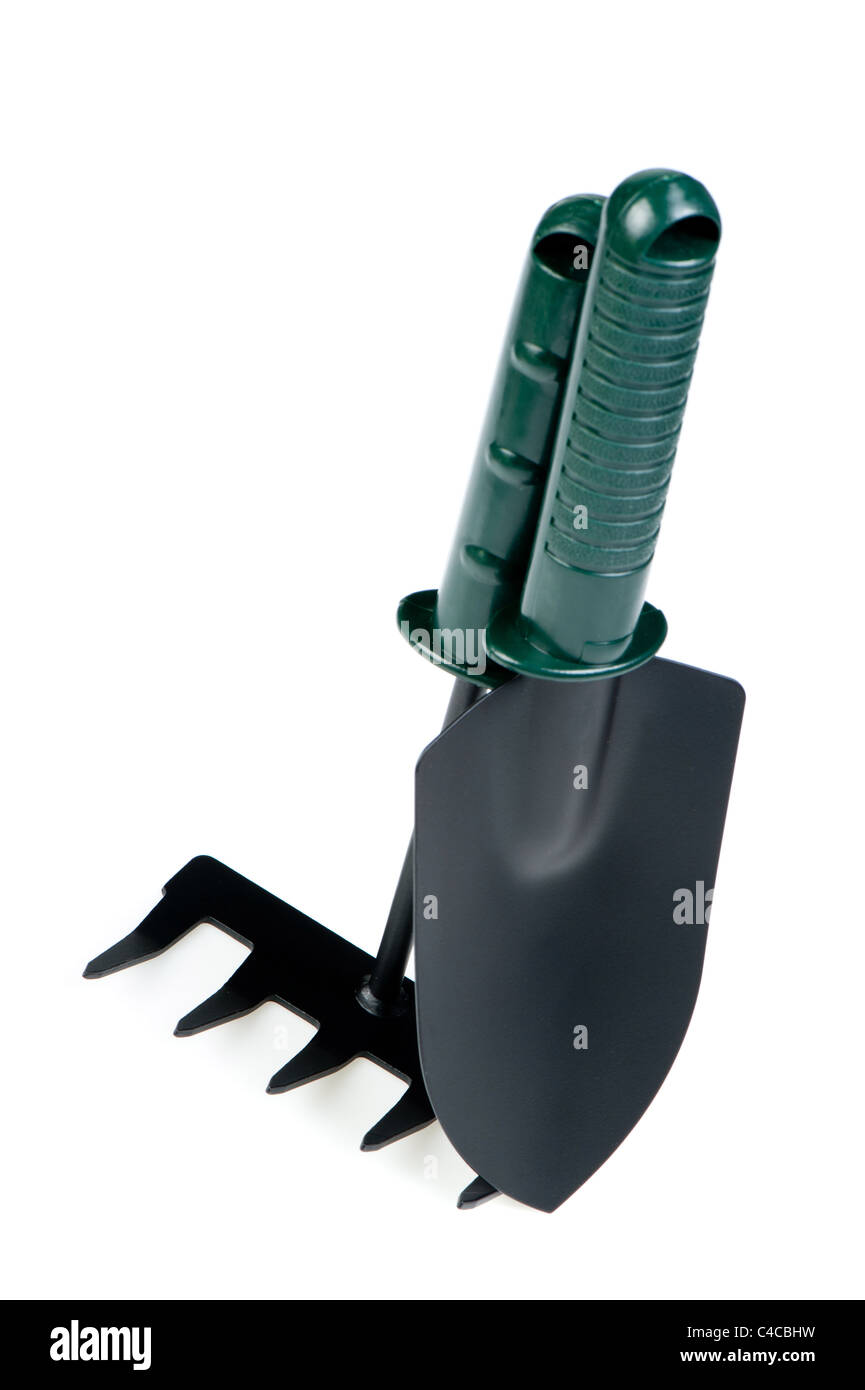The garden tool a shovel, a rake. Isolated on a white background Stock ...