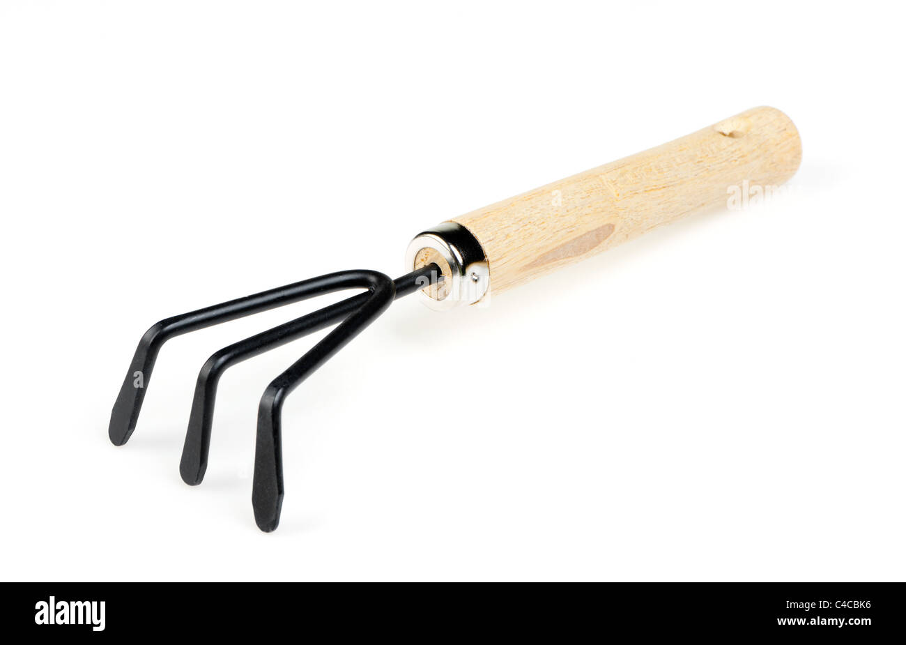 The garden tool a rake. Isolated on a white background Stock Photo - Alamy