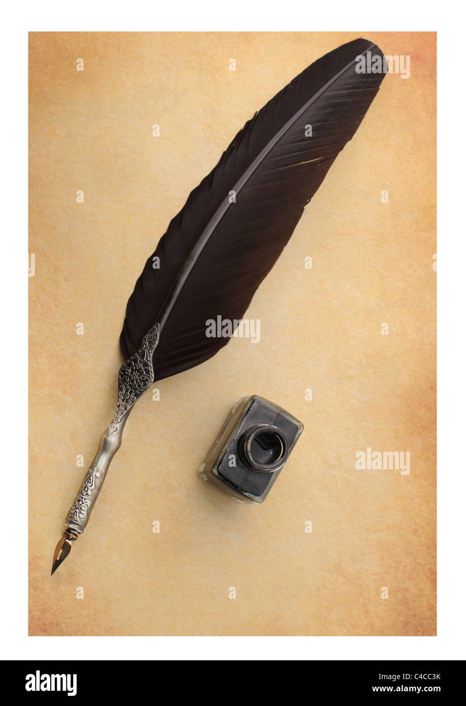 Feather quill and inkwell on an old paper Stock Photo - Alamy