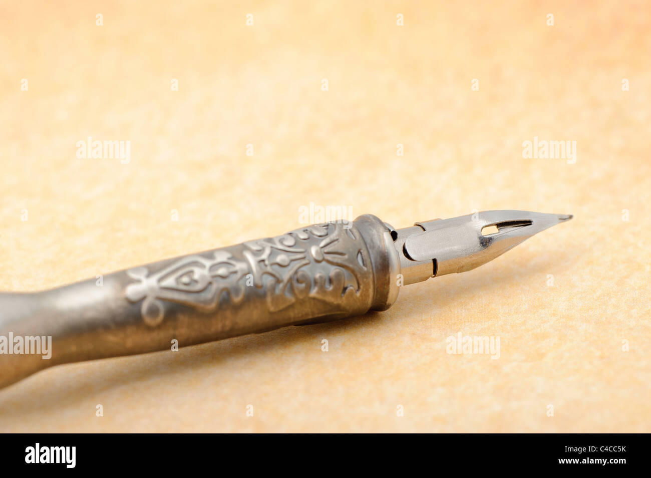 Feather quill an old paper. Photo closeup Stock Photo - Alamy