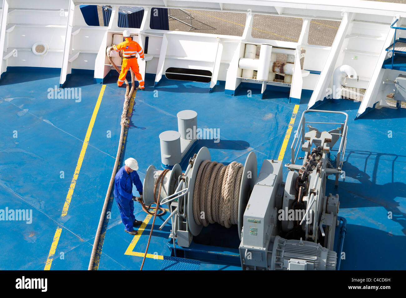 seaman seamen deckhands working work ship winch ropes warps Stock Photo ...