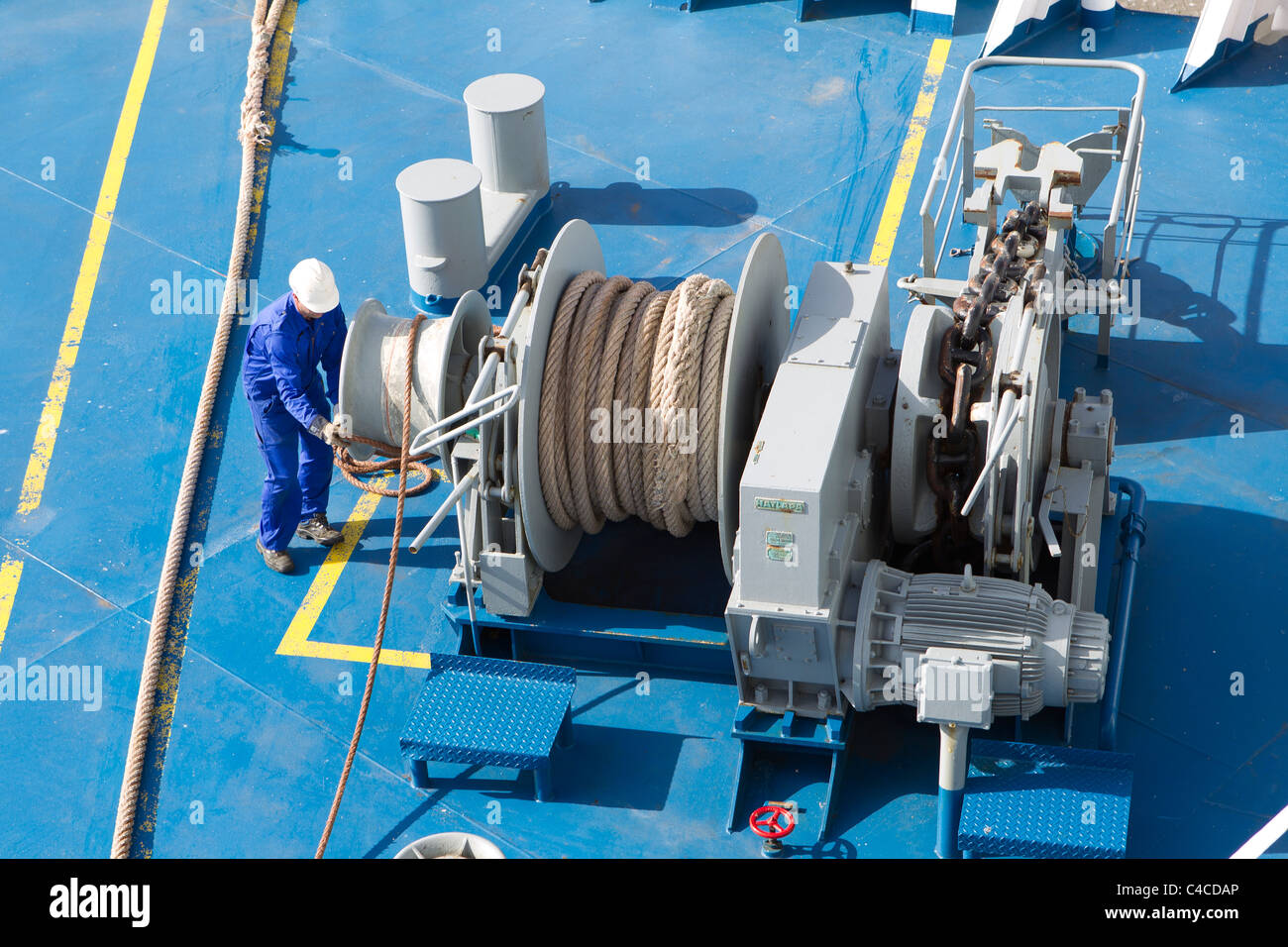seaman seamen deckhands working work ship winch ropes warps Stock Photo ...