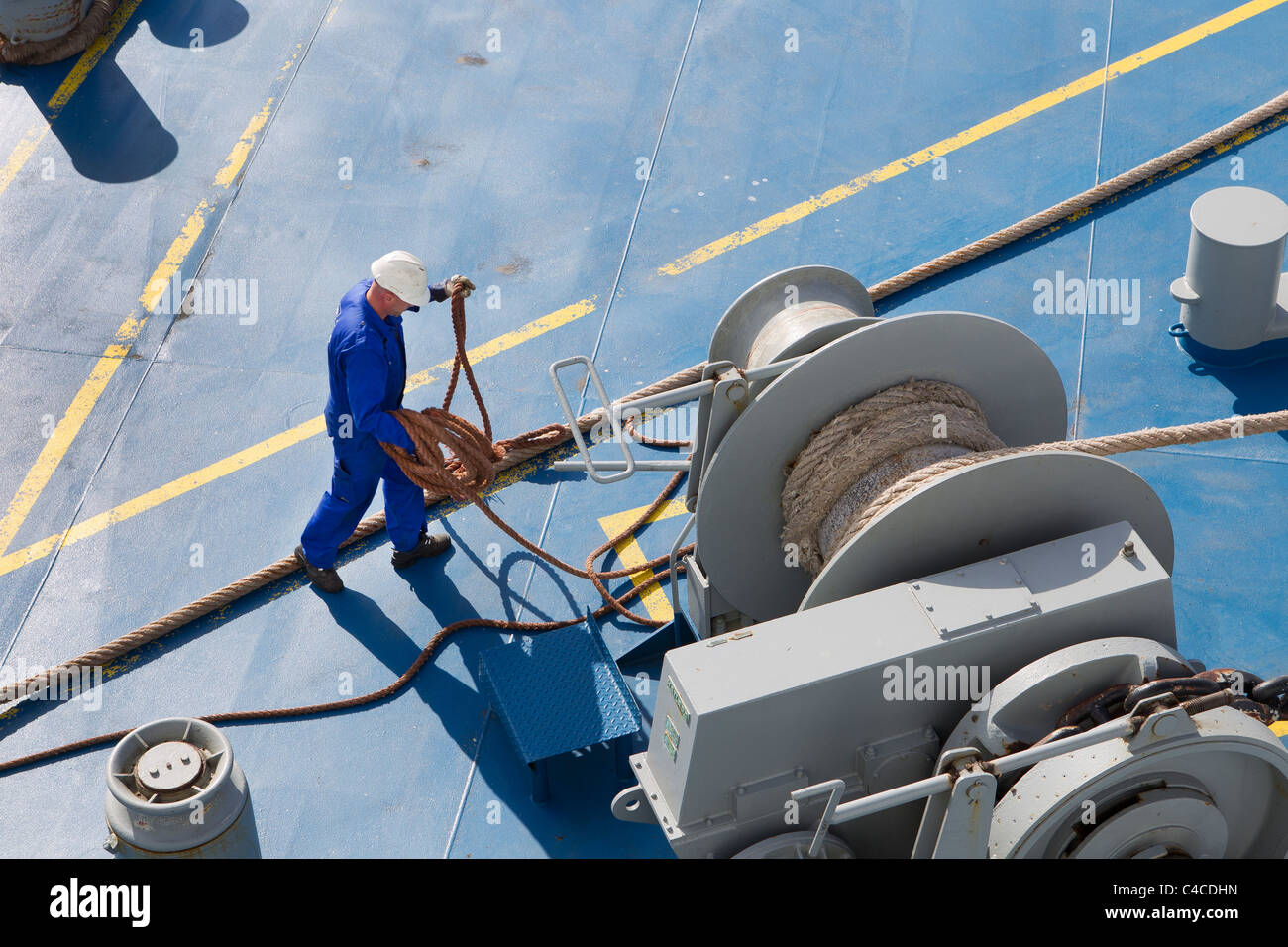 seaman seamen deckhands working work ship winch ropes warps Stock Photo ...