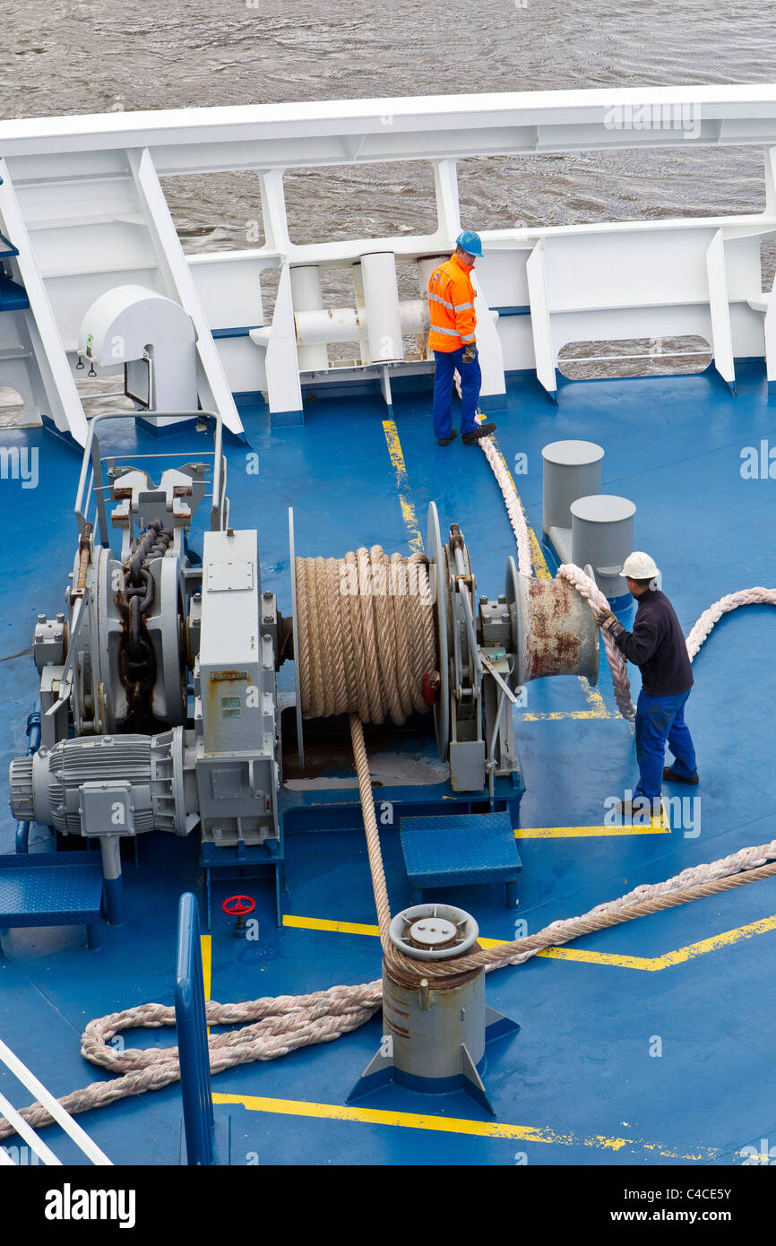 seaman seamen deckhands working work ship winch ropes warps Stock Photo ...