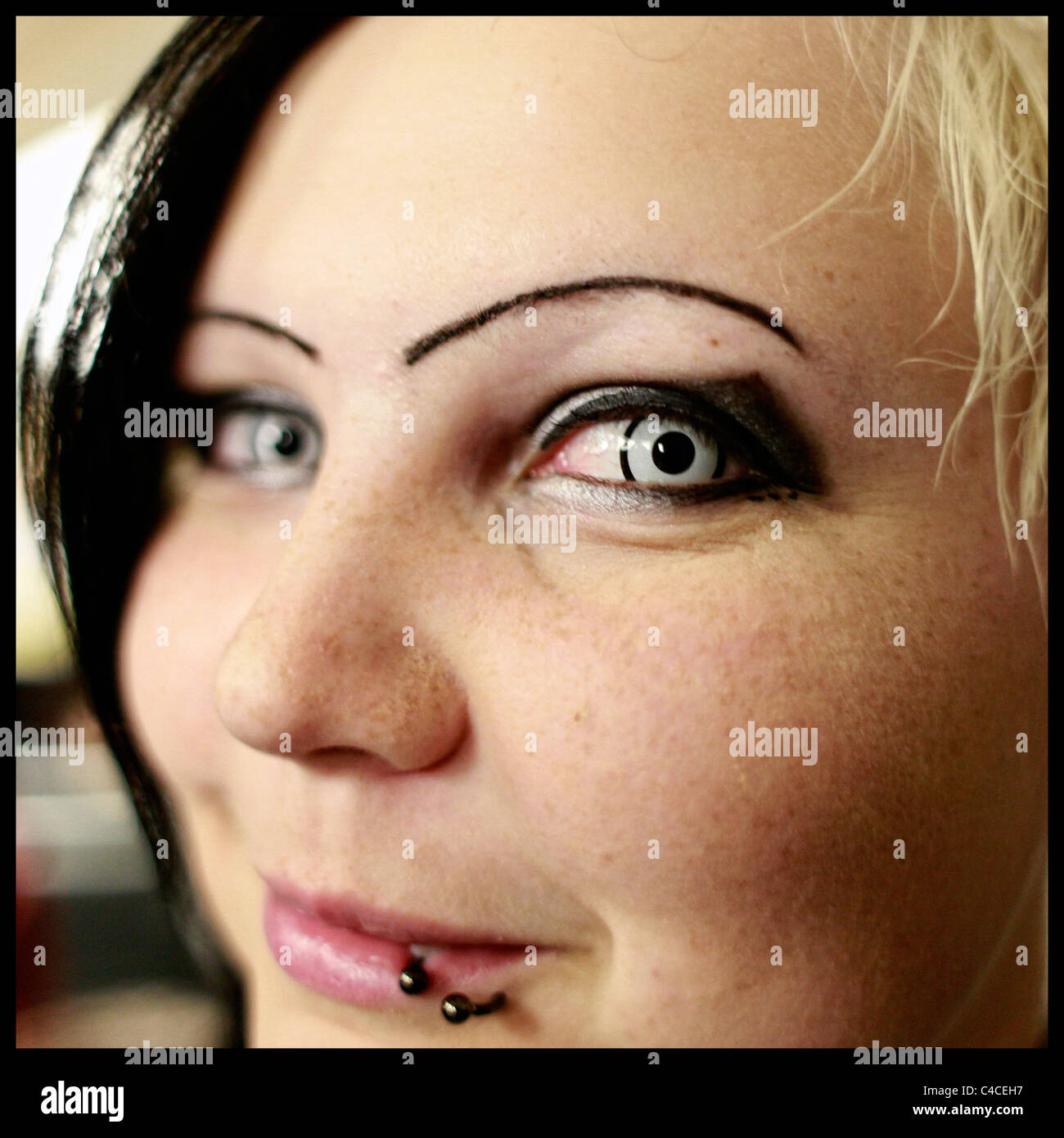 Gothic enthusiast wearing funky colored eye contact lenses at the ...