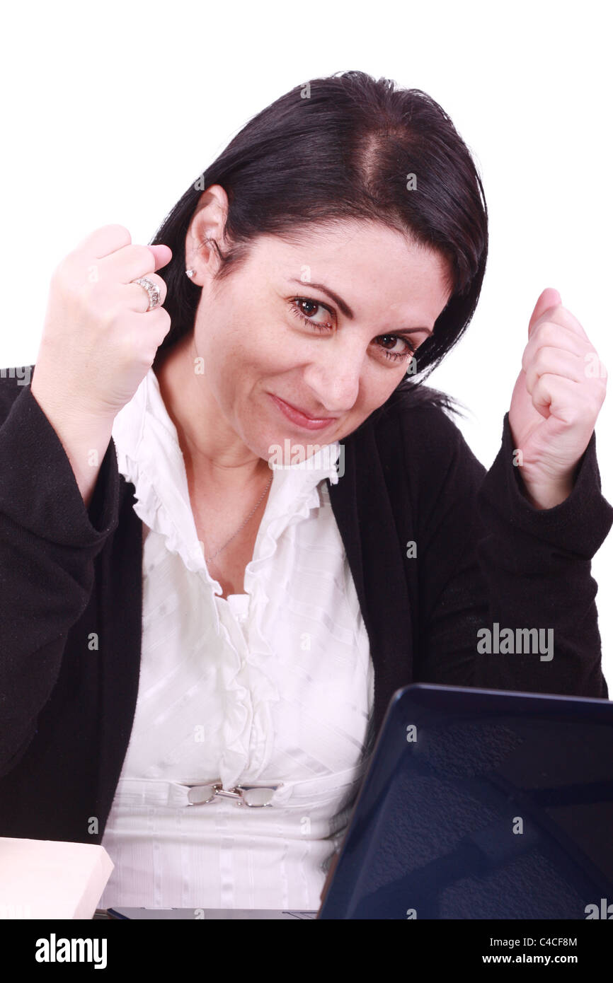 Business woman happy in front of her laptop at the office Stock Photo ...