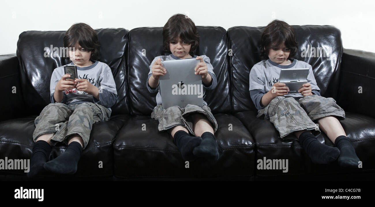 Small Child using Ipad, Ipod, Nintendo DS Stock Photo - Alamy