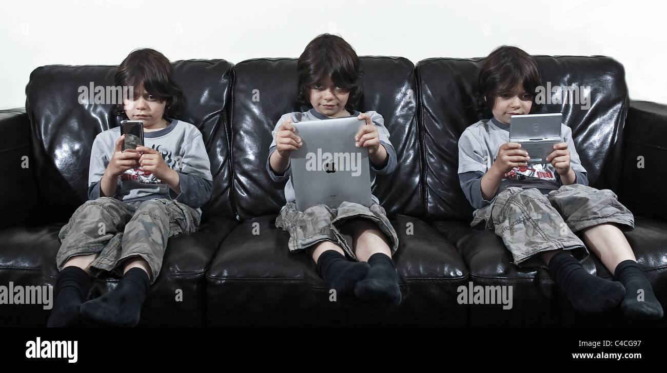 Small child playing with Ipad, Ipod, Nintendo DS Stock Photo - Alamy