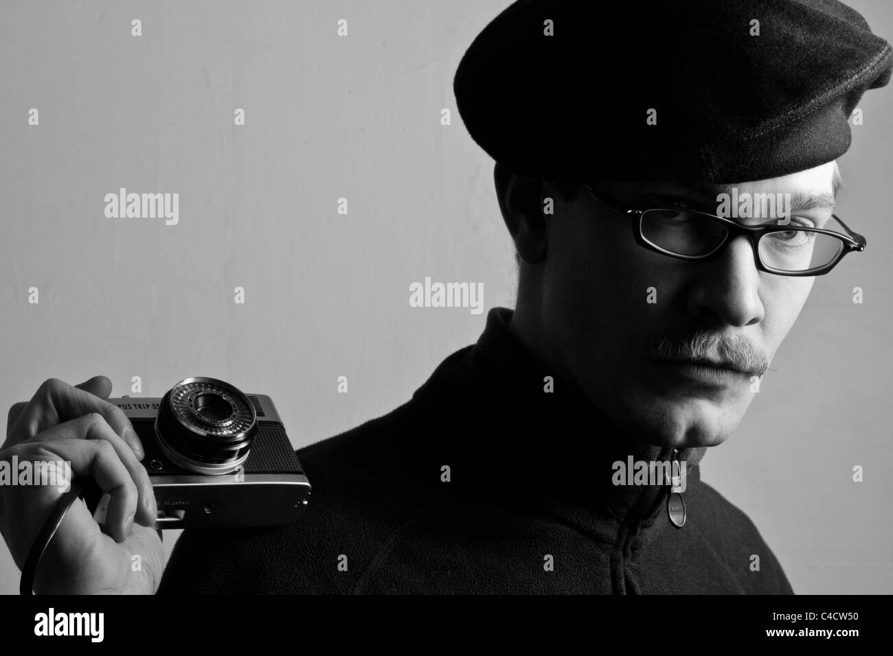 Portrait of a man with a camera in black and white Stock Photo - Alamy