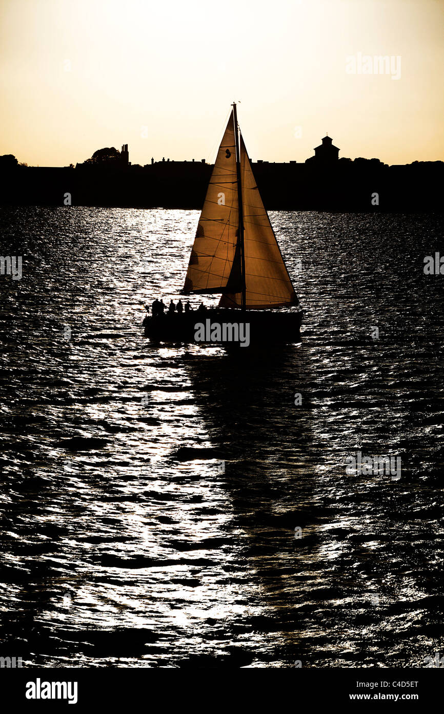 Yacht boat at sunset sailing in the Solent to the Isle of Wight ...