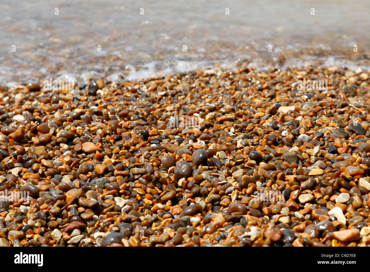 Shingle and pebbles on the beach in Alum Bay in the Isle of Wight ...