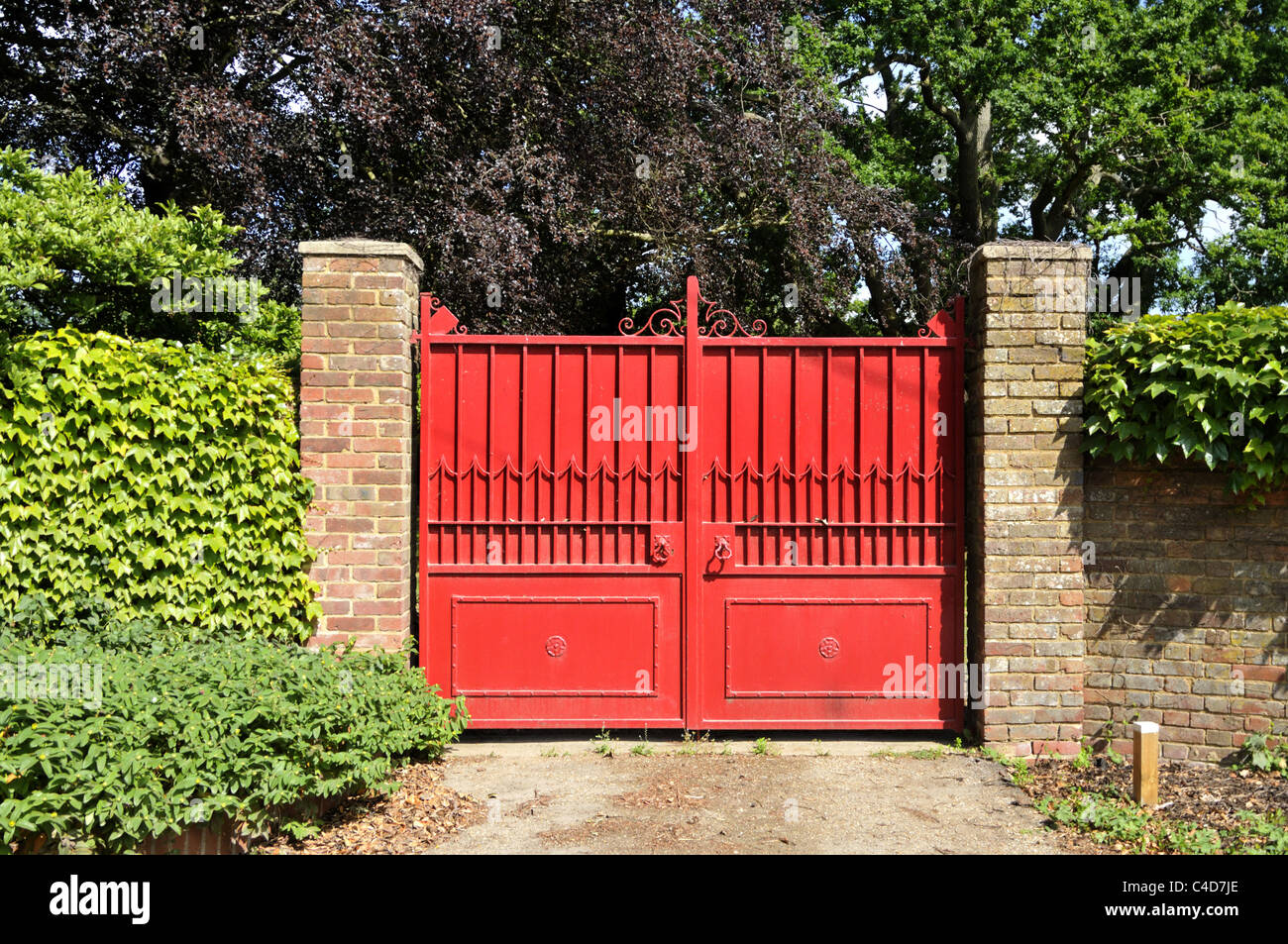 Closed red metal gate Stock Photo - Alamy