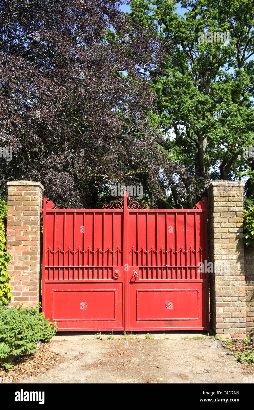 Closed red metal gate Stock Photo - Alamy