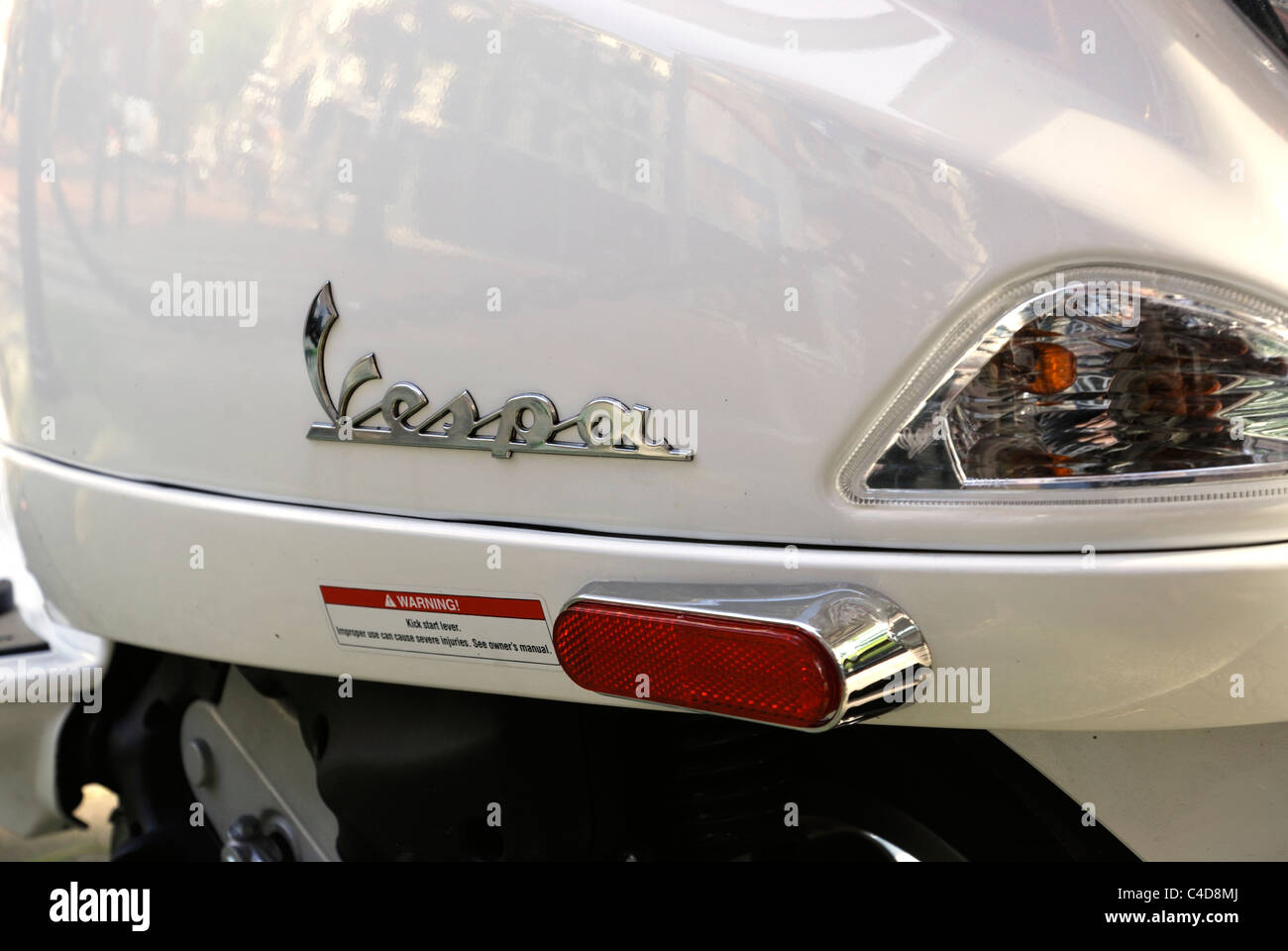 The rear end of a white Vespa scooter Stock Photo - Alamy