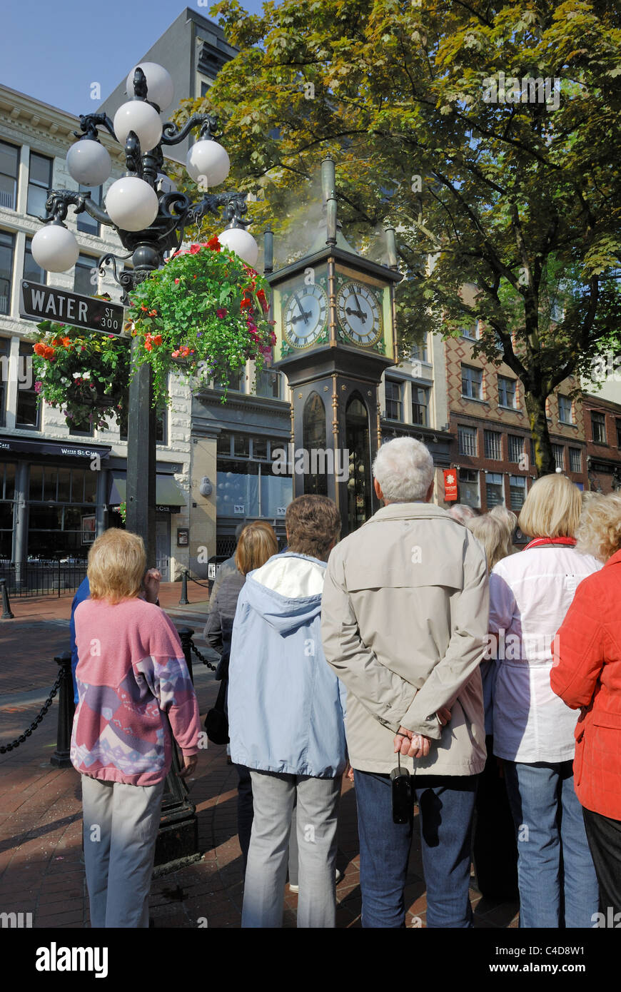 People watching the ever popular Steam clock built in 1977 blow off ...