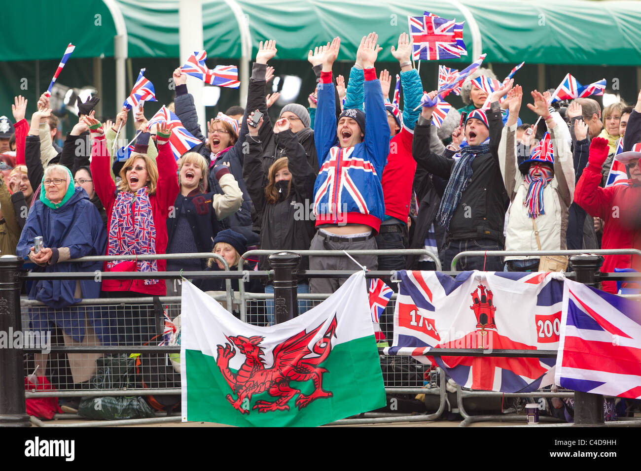Crowds do the wave while waiting for the royal wedding of Prince ...