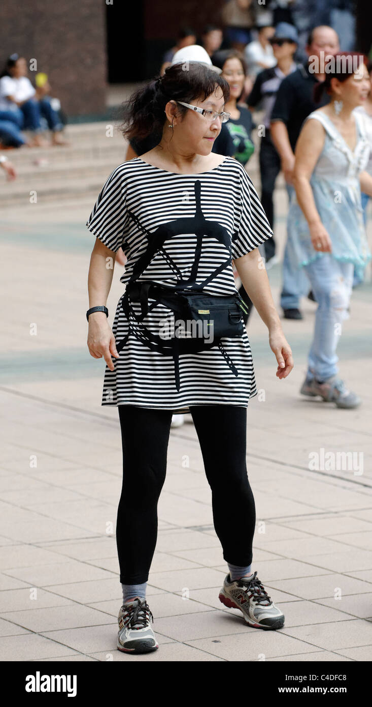 Line dancing woman in Singapore, at a competition on Orchard Road Stock ...