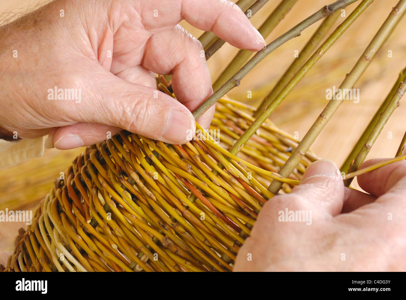Old man's hands and wicker basket Stock Photo - Alamy