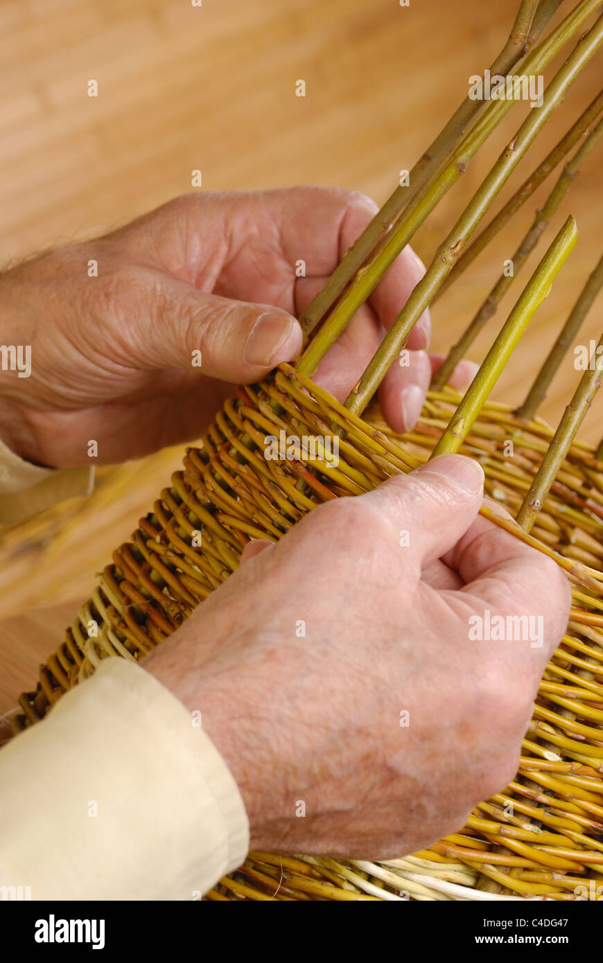 Old man's hands and wicker basket Stock Photo - Alamy