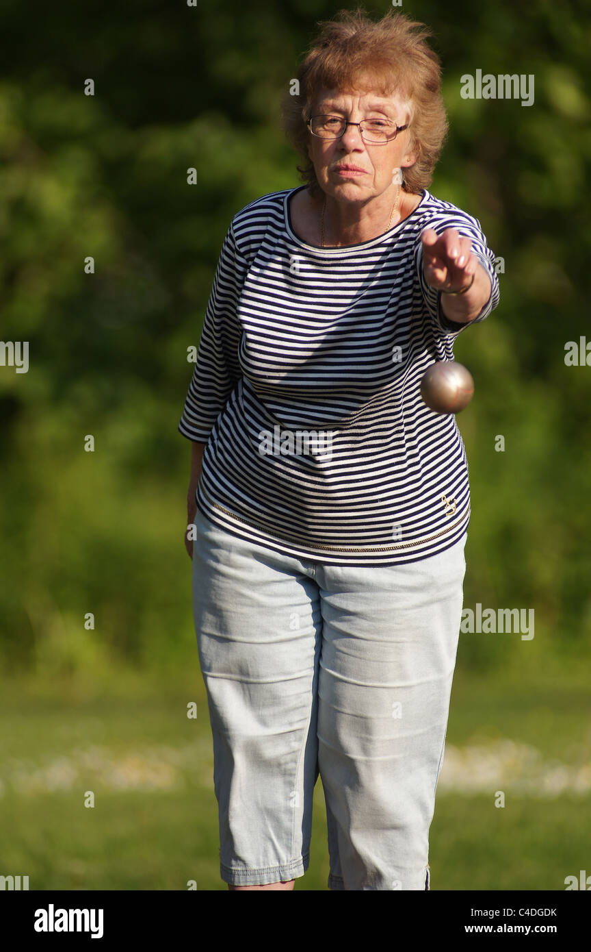 elderly woman playing boule in sweden Stock Photo - Alamy
