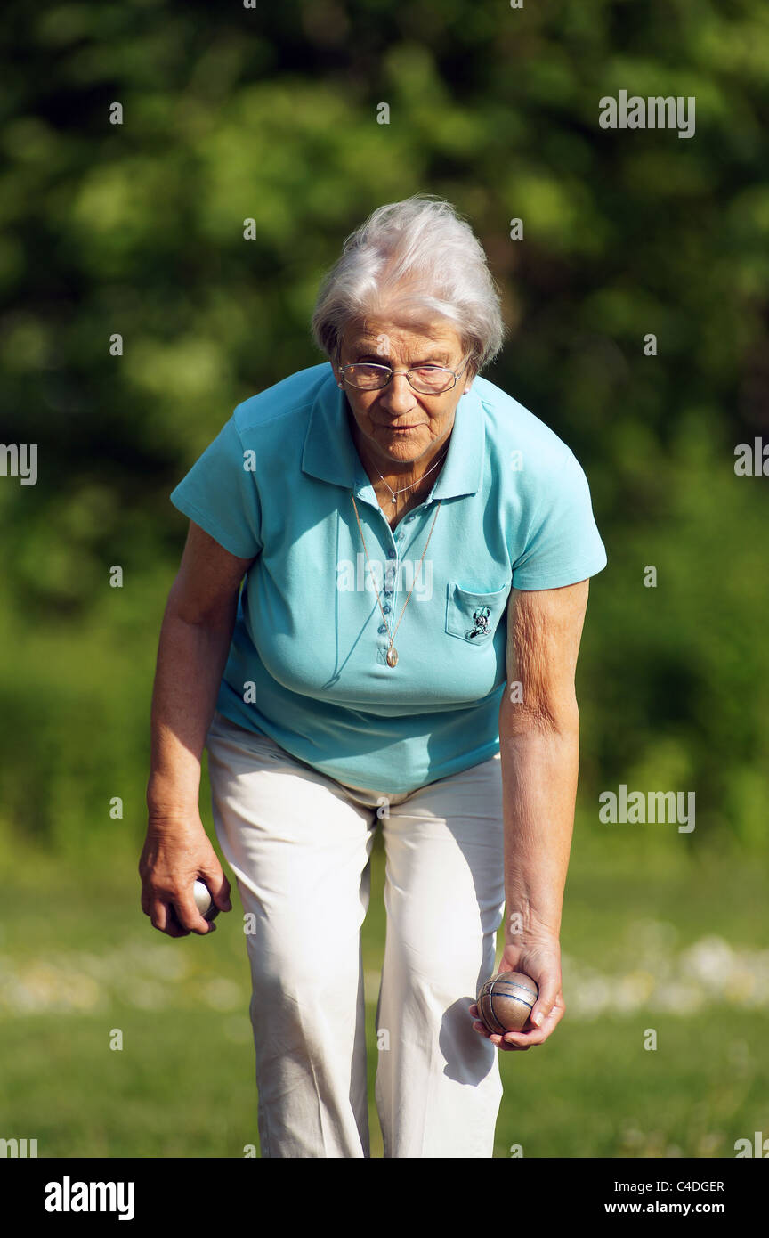 old woman playing boule in sweden Stock Photo - Alamy