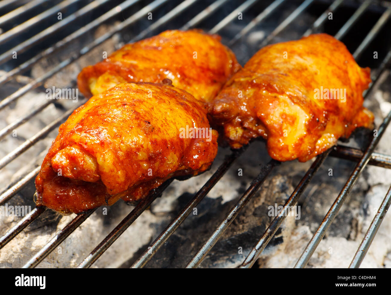 a traditional style bbq with chicken cooking on the grill Stock Photo ...