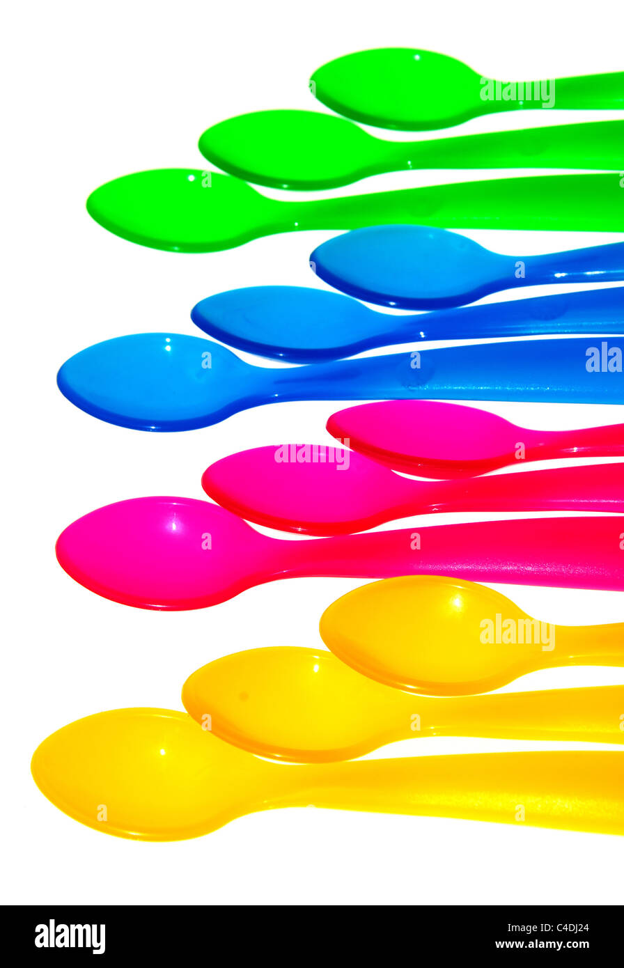 Twelve colorful spoons on a white background Stock Photo - Alamy
