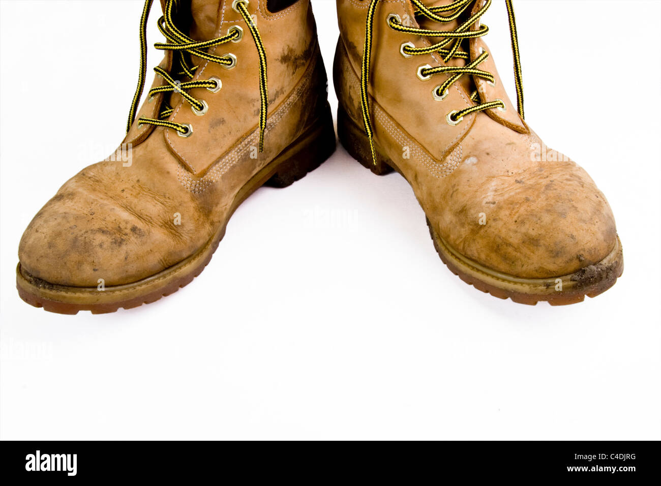 Dirty brown leather boots Stock Photo - Alamy