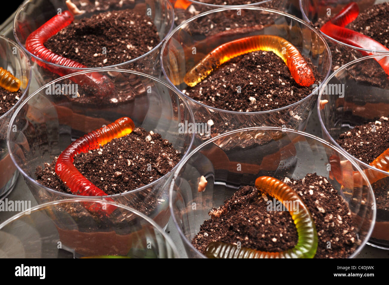 Multiple Dirt and Worms Desert in Small Plastic Cups Stock Photo - Alamy