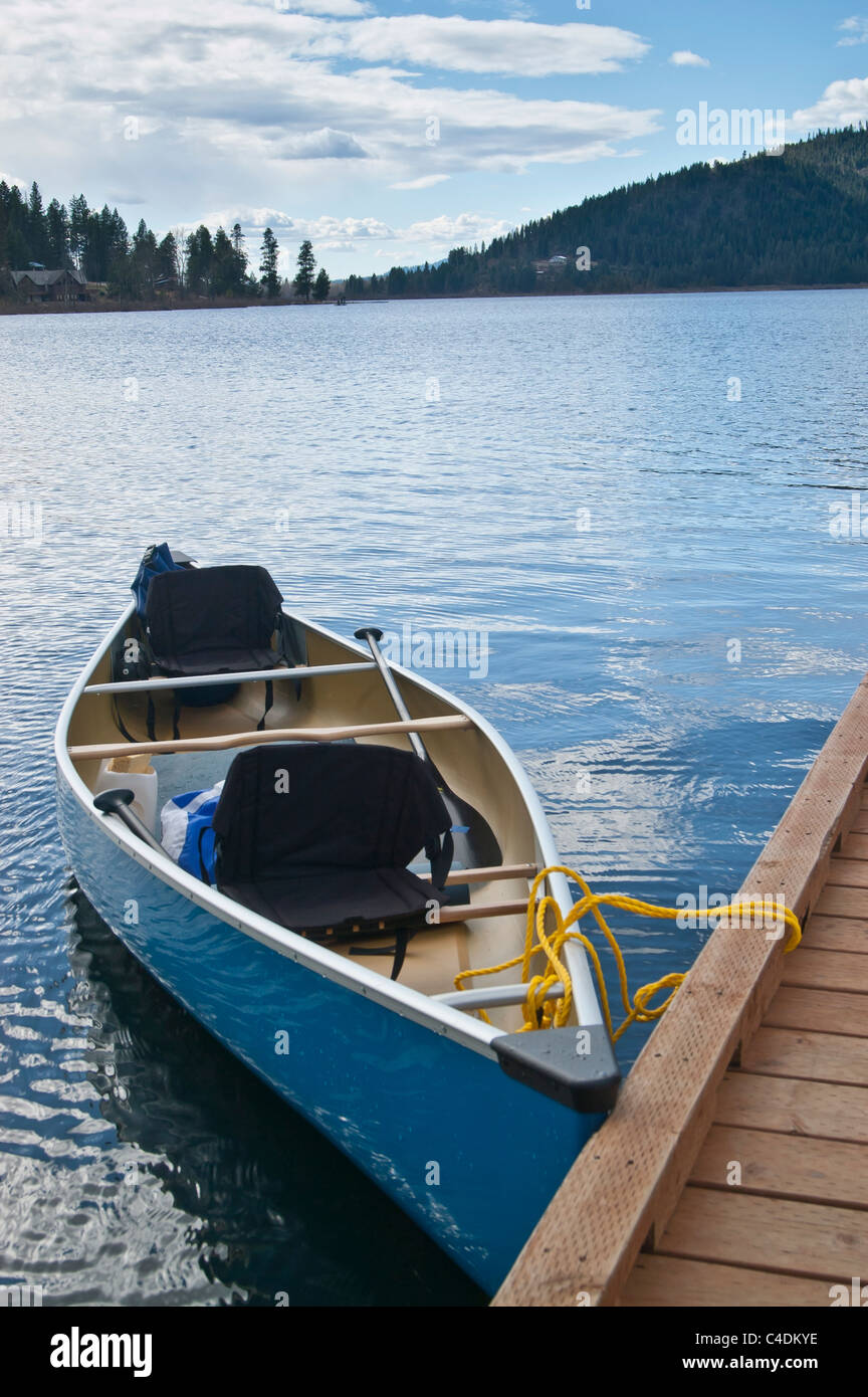 An empty canoe sits at the Rose Lake dock in northern Idaho Stock Photo ...