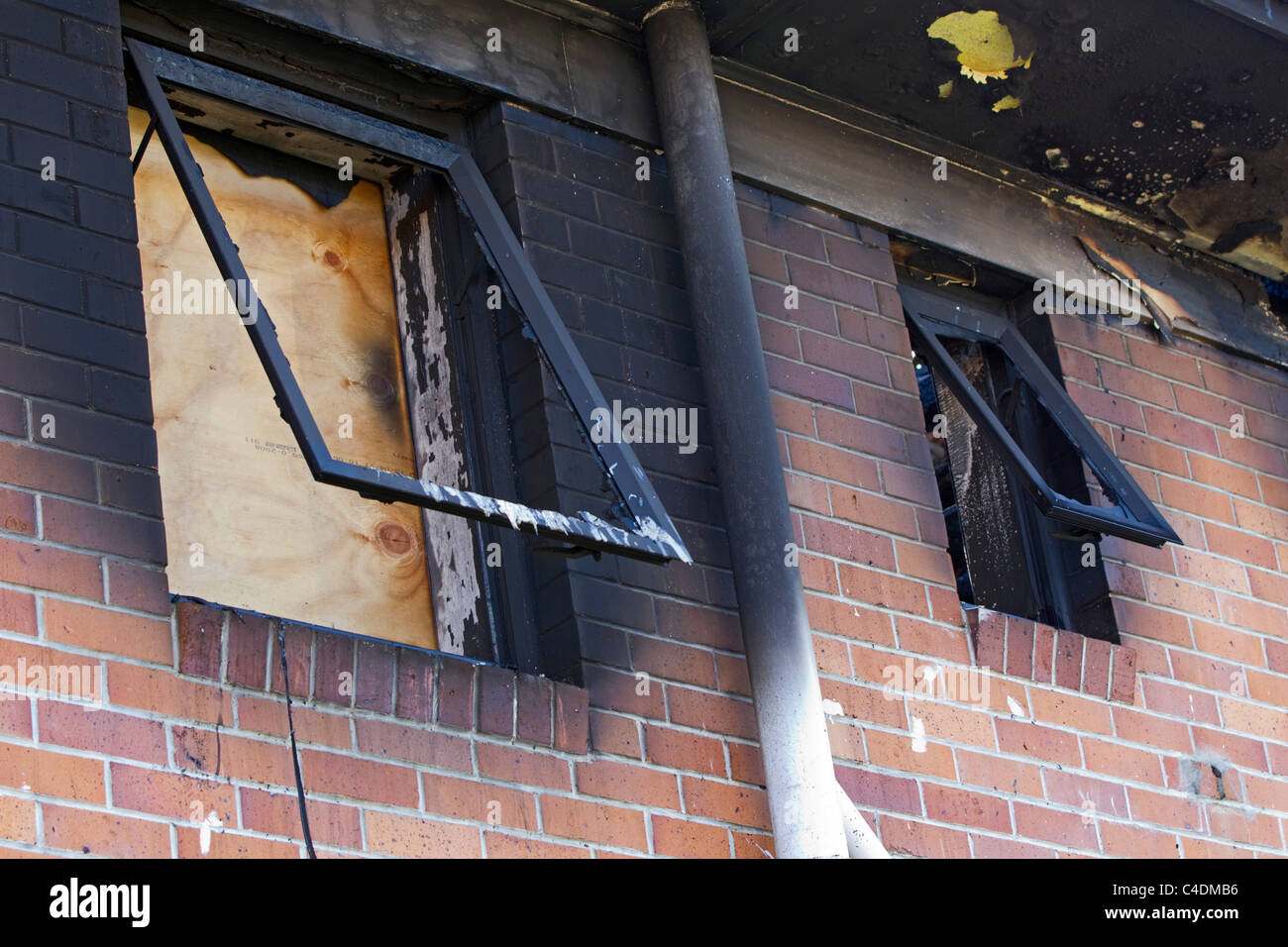 Burnt out windows and roof at the scene of a fire following a suspected ...