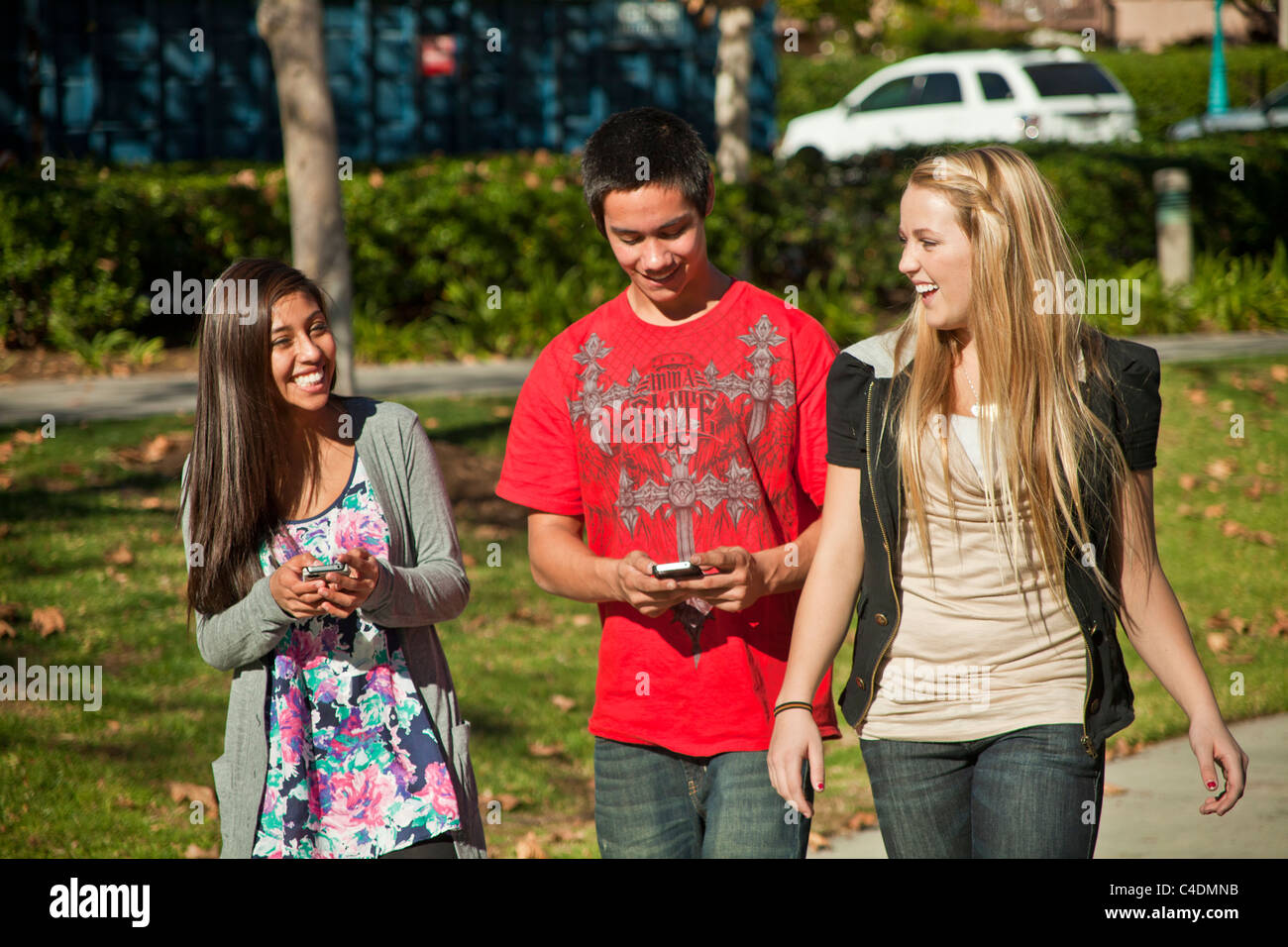 Group Teen Hispanic Talking Park High Resolution Stock Photography and ...