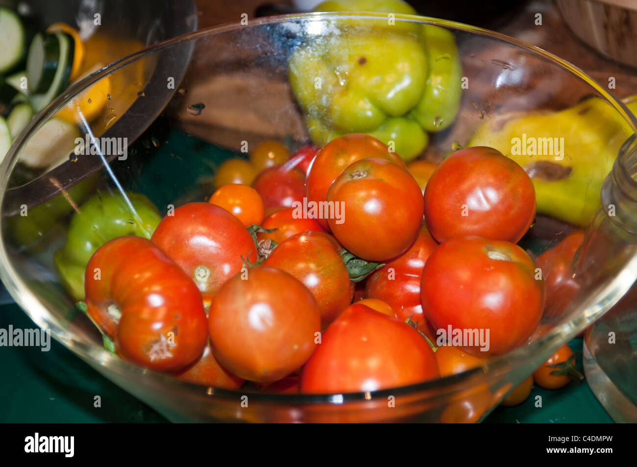 Fresh picked red tomatoes are prepared in the kitchen at the PEAS Farm ...