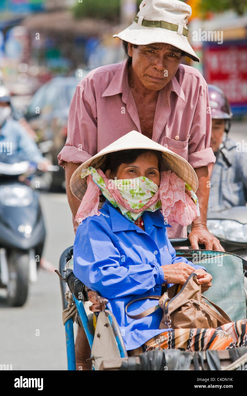 Cyclo driver and passenger Stock Photo - Alamy