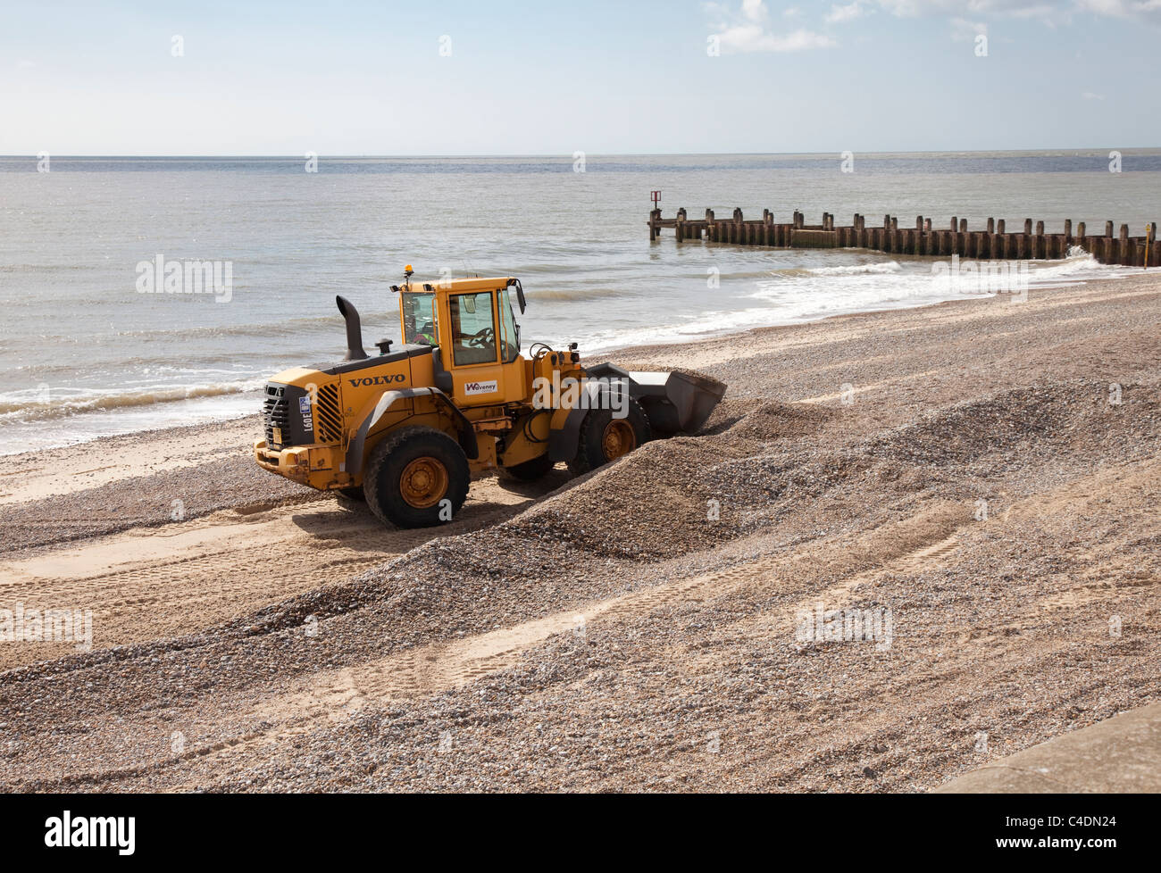Lowestoft Beach tractor Stock Photo - Alamy