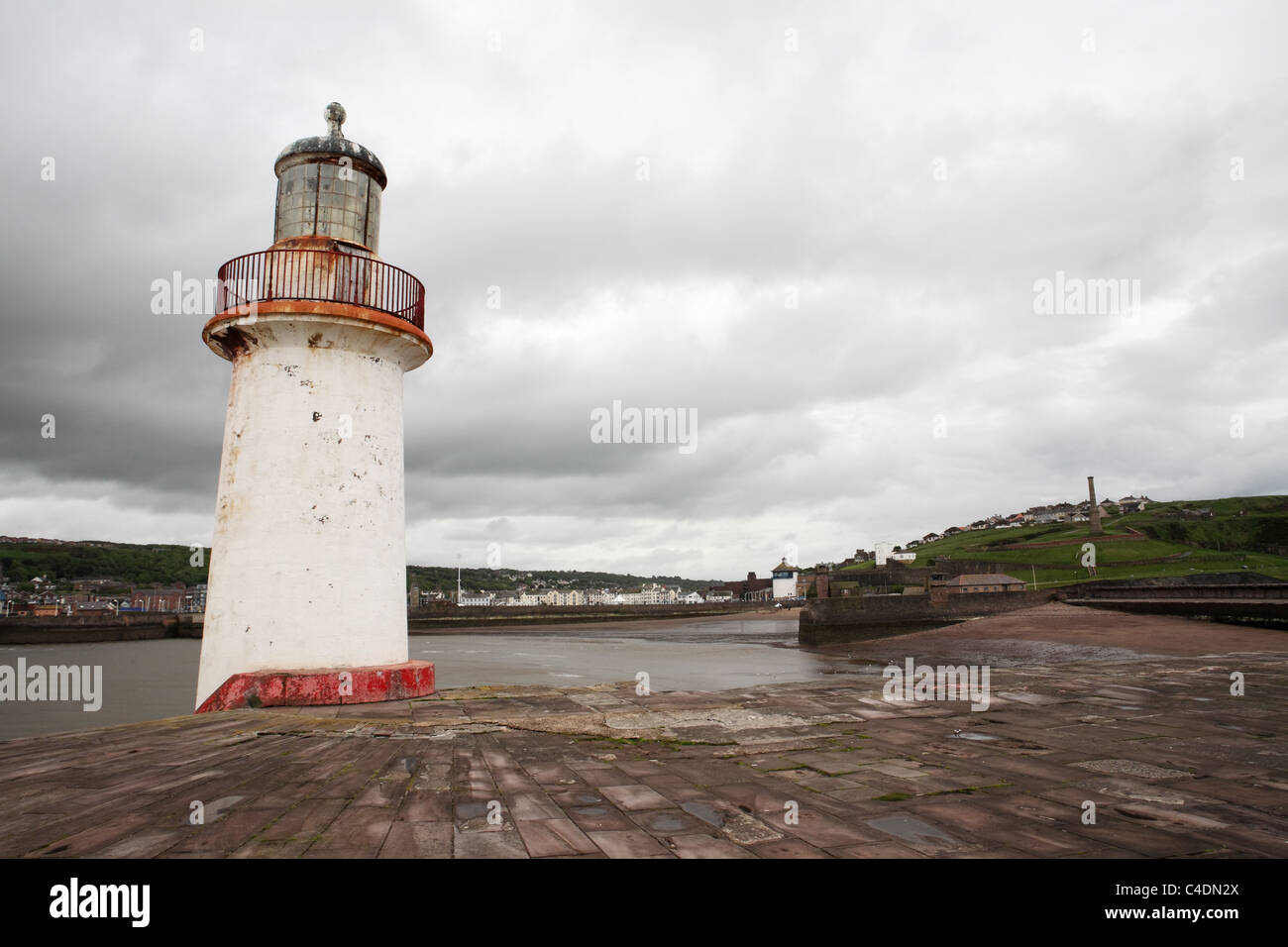 Lighthouse and harbour on a dull day Whitehaven, Cumbria, England UK ...