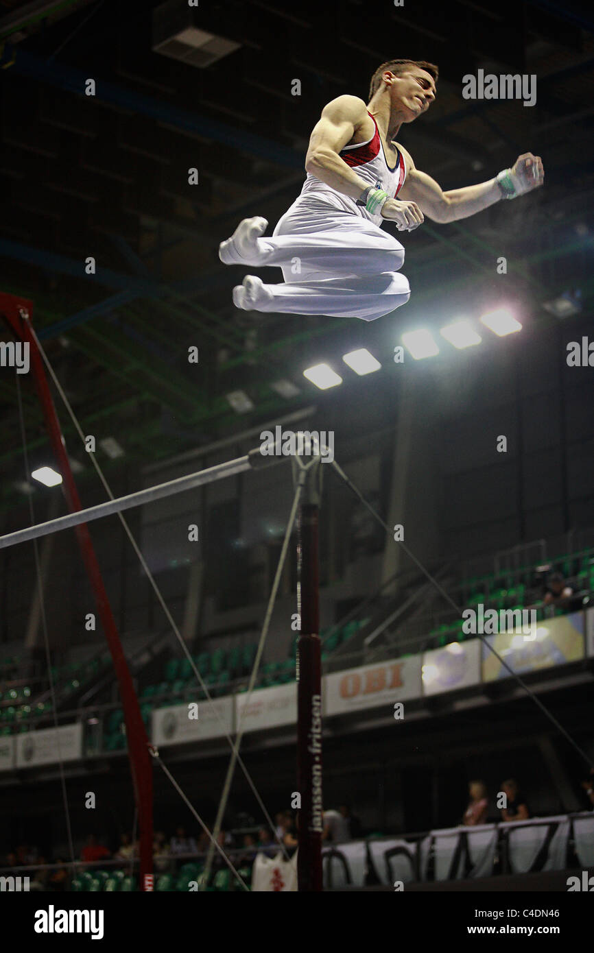 gymnastics competition: a gymnast's ending his high bar routine Stock ...