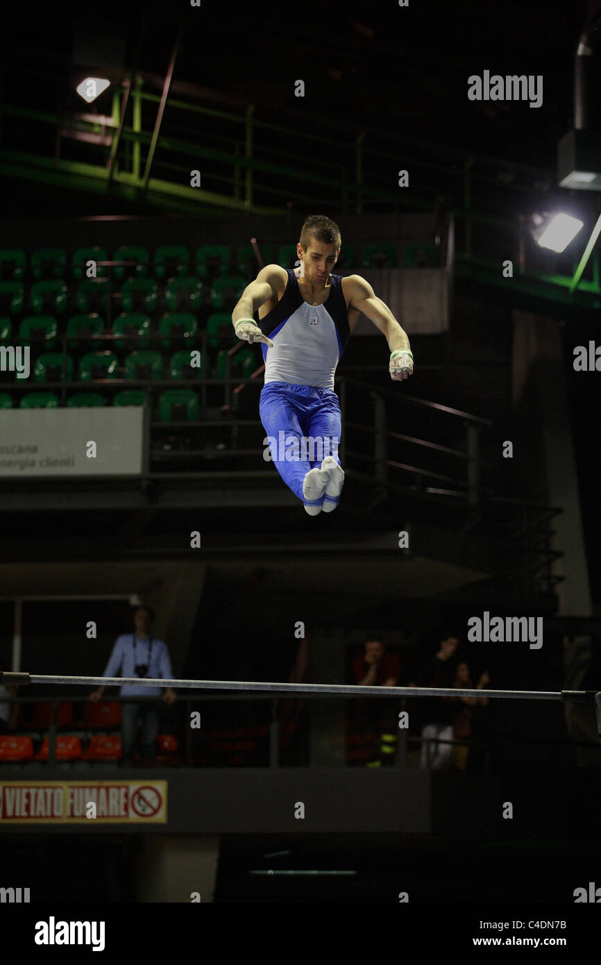 Gymnastics competition: Lorenzo Ticchi performing a "Tkatchev " at the ...
