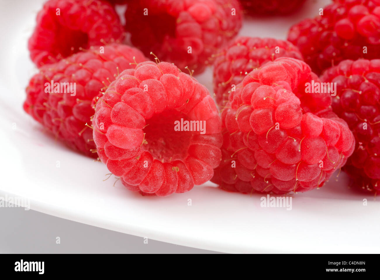 fresh raspberries over white Stock Photo - Alamy