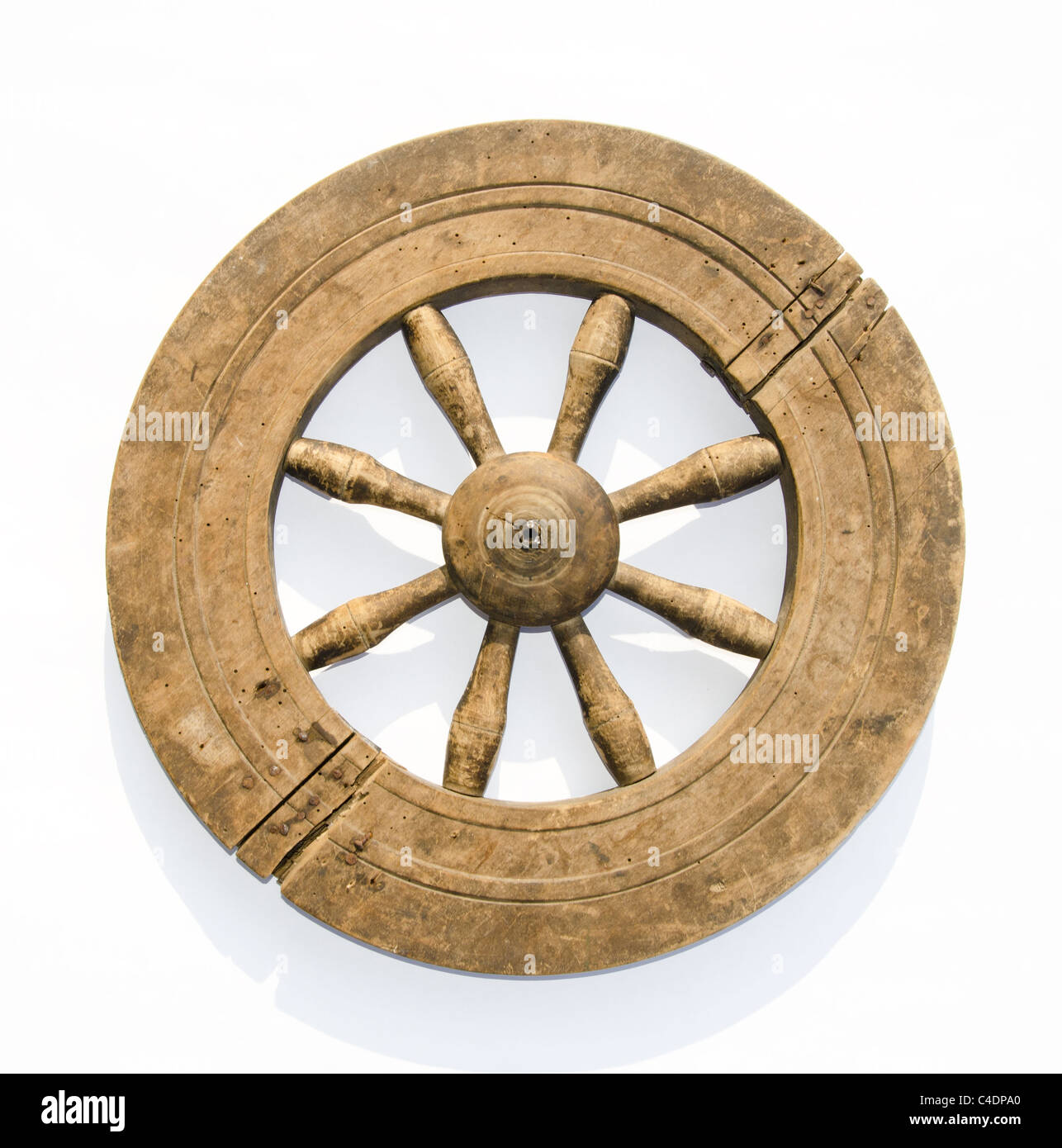 old grunge spinning wheel on white background Stock Photo - Alamy