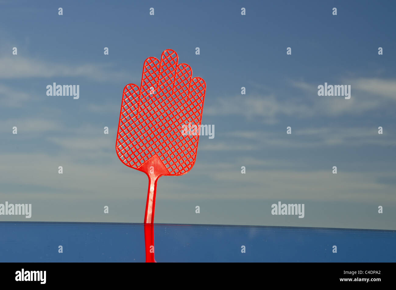 red hand symbol and blue sky background Stock Photo - Alamy