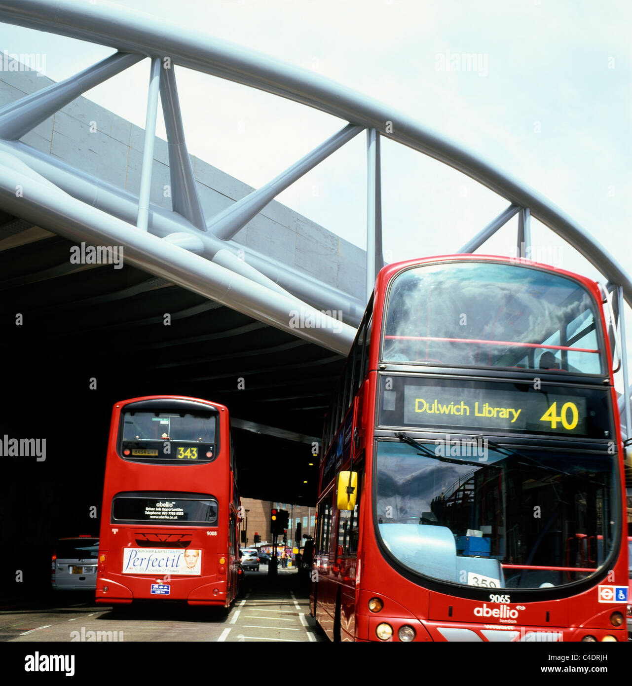 Red double-decker buses pass under Network Rail's new Viaduct Bridge ...
