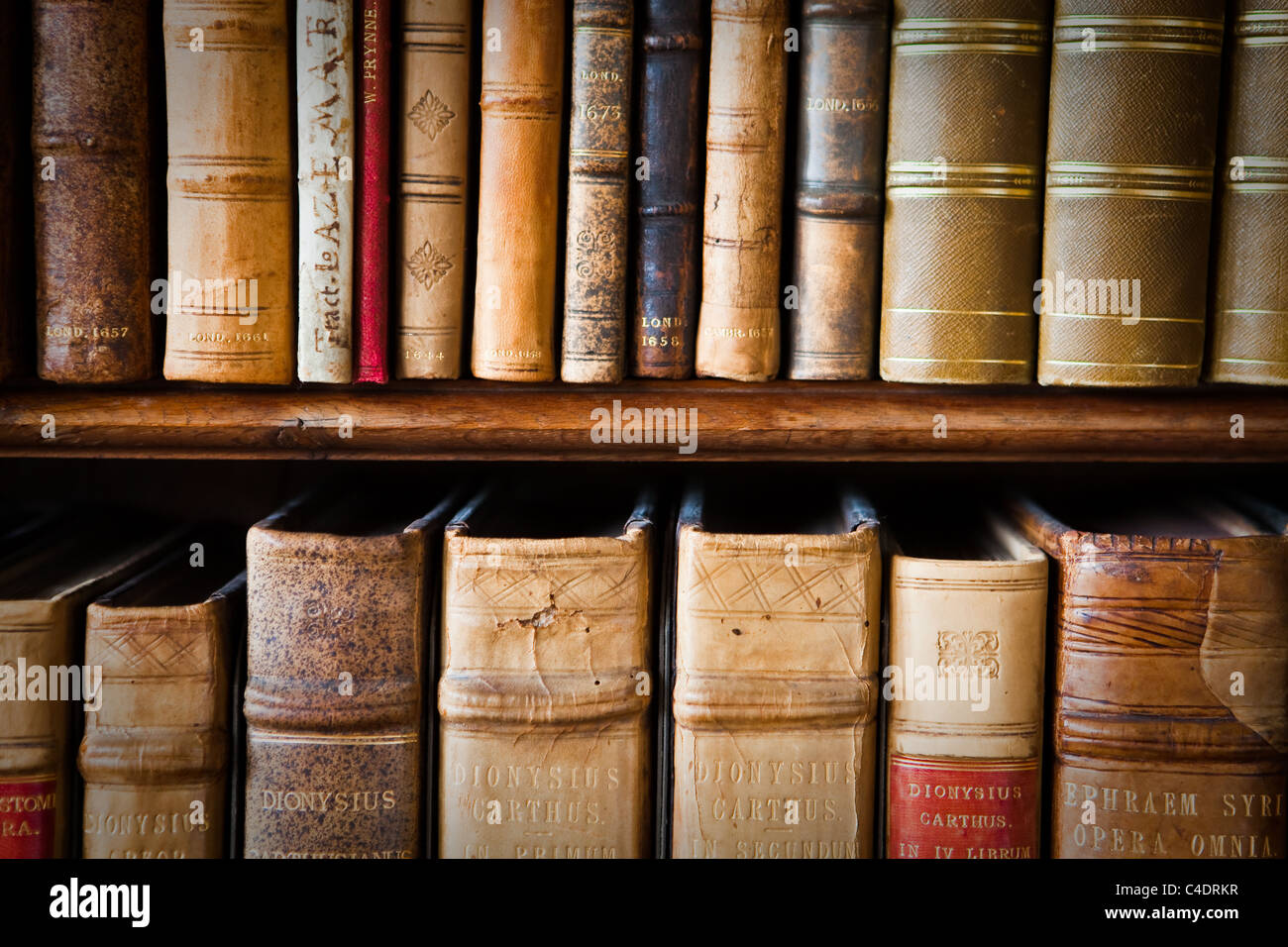 Old books in a library Stock Photo - Alamy