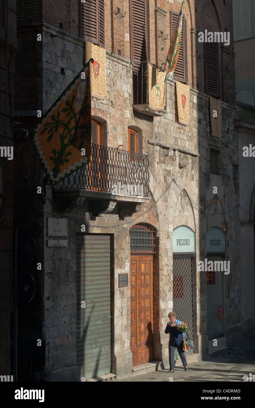 Dawn streetscene flag banner palio horse race festival ancient medieval ...