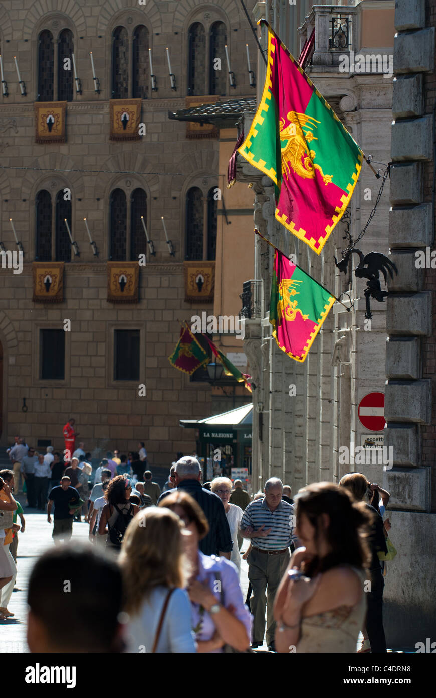 Sienna on the day of the famous Palio horse race with flags and banners ...