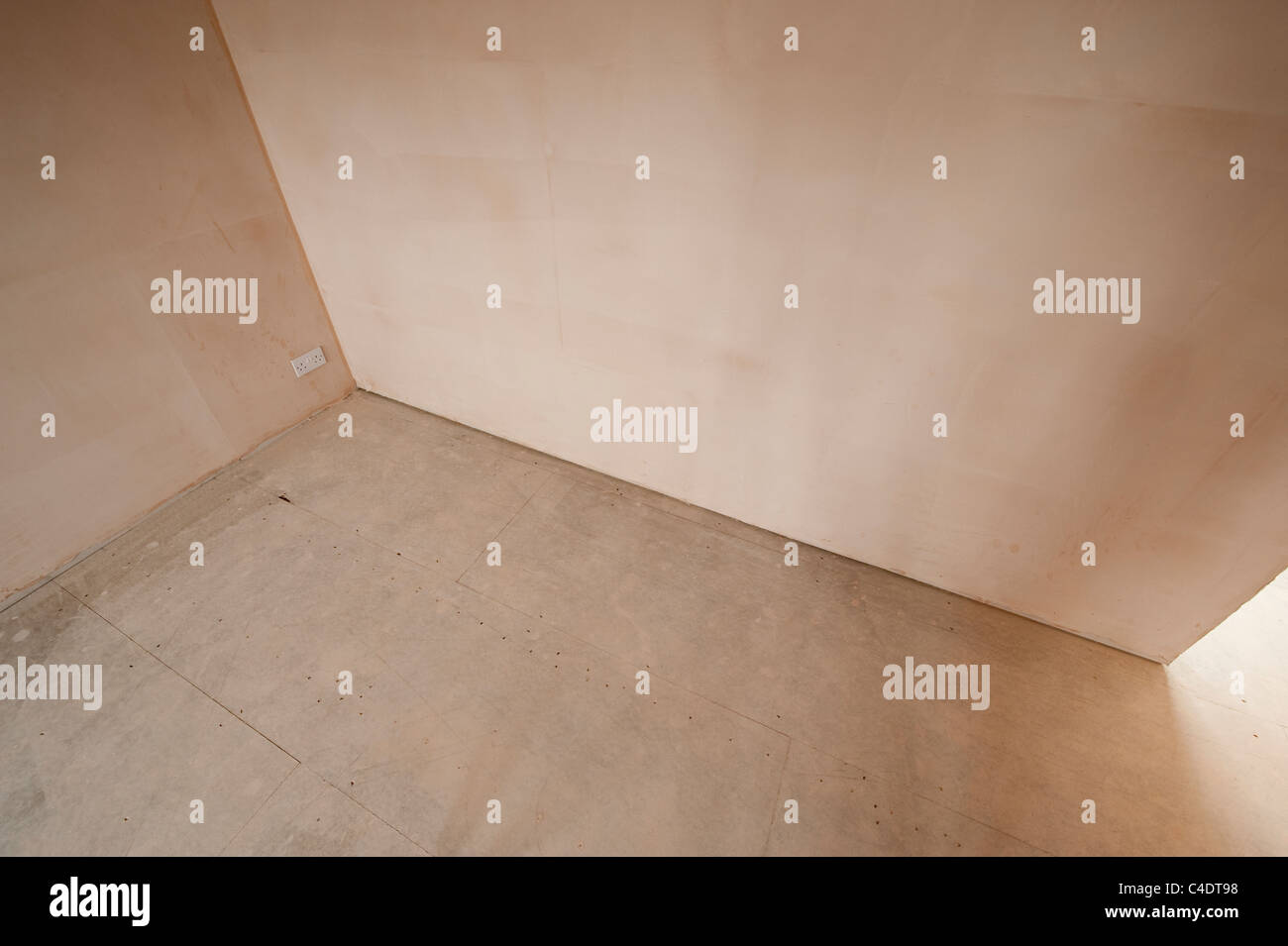 Corner of newly plastered room with electric powerpoint in wall Stock ...