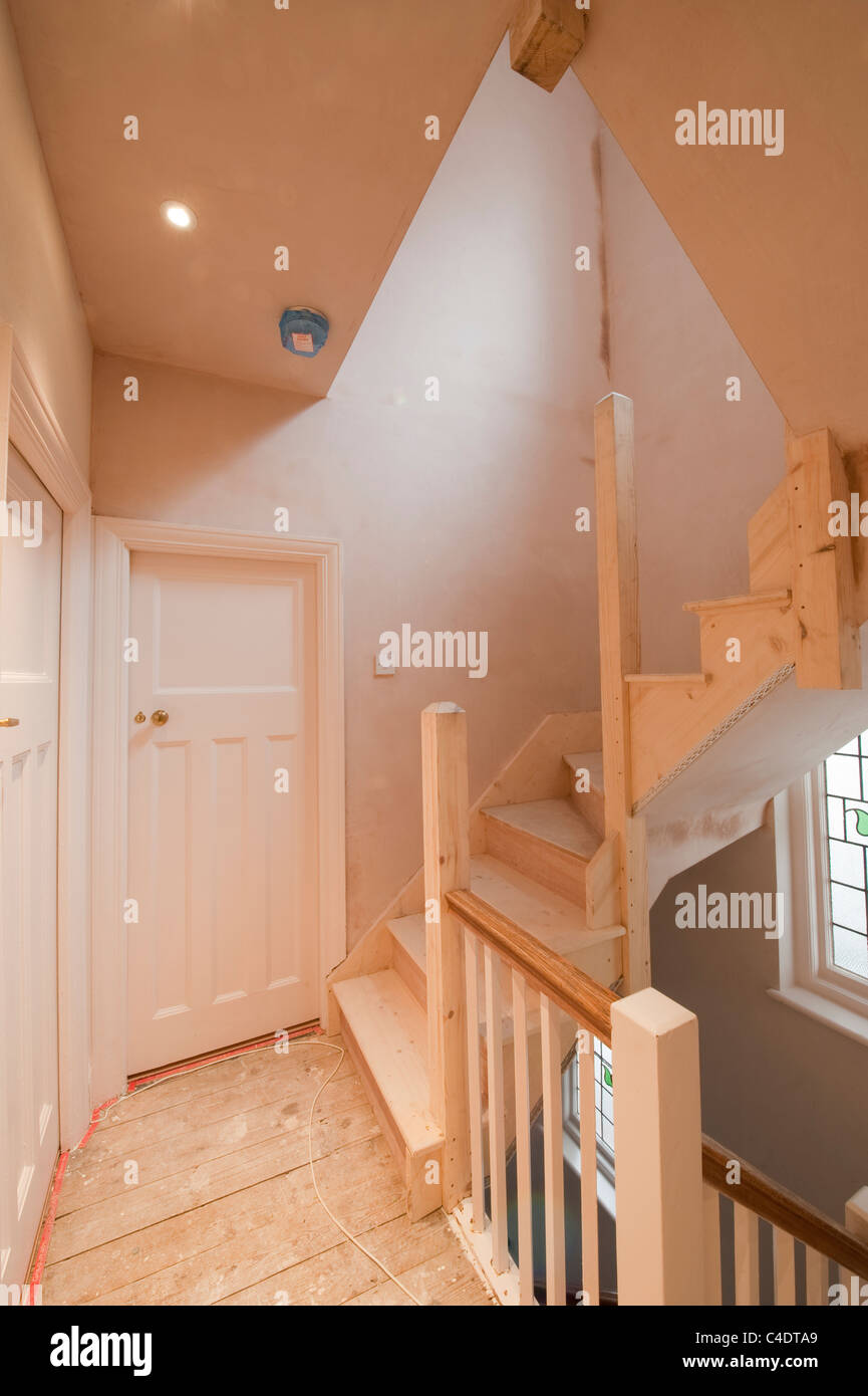 Existing staircase and new installed staircase leading to attic ...